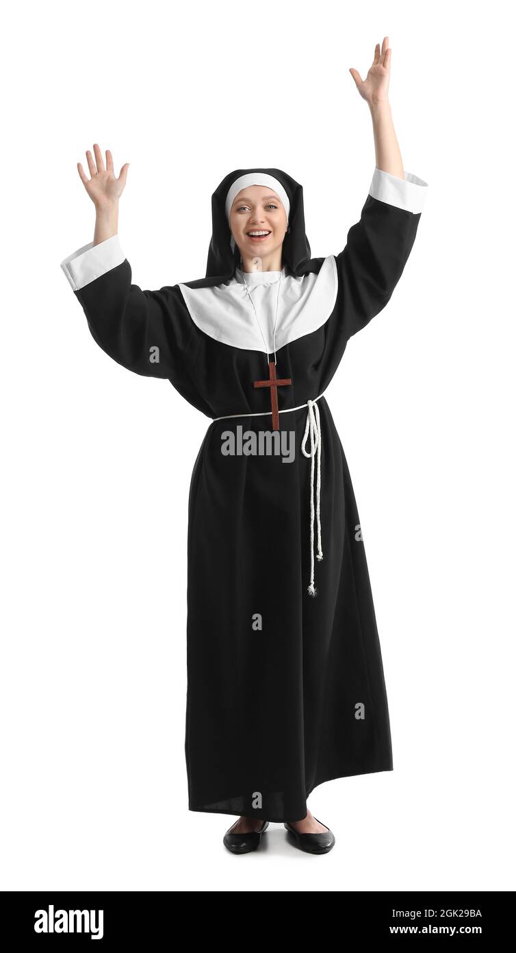 Happy young nun on white background Stock Photo - Alamy