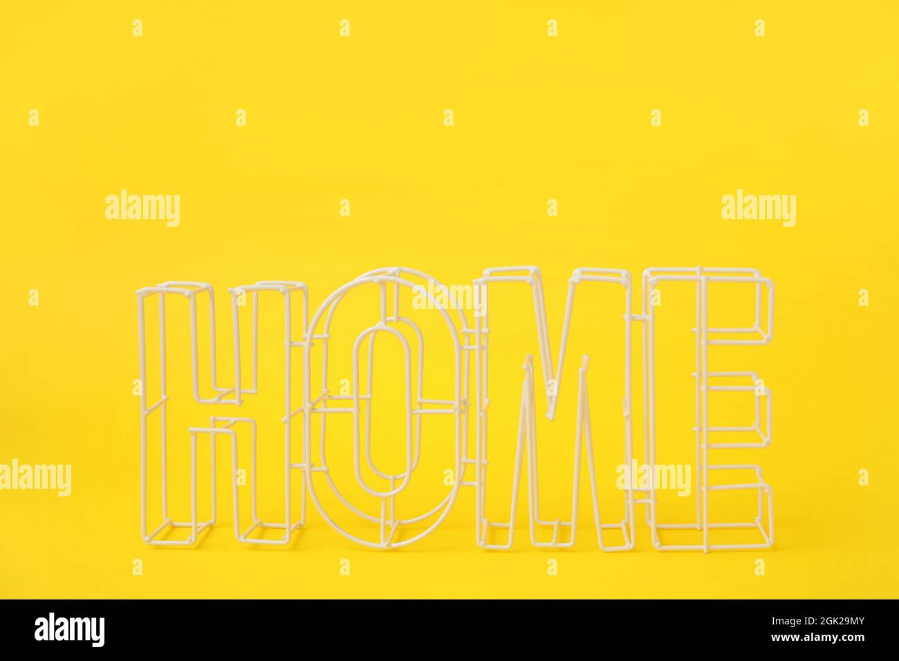 Stylish decor in shape of word HOME on color background Stock Photo - Alamy