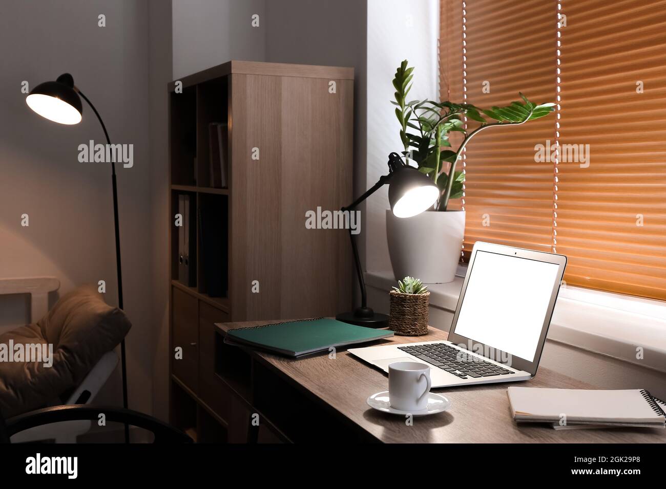 Modern workplace with laptop near window Stock Photo - Alamy