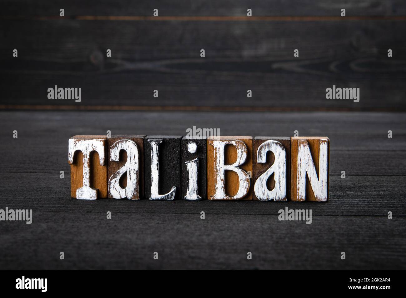 Taliban. Afghanistan's political and culture. White wooden letters on a ...