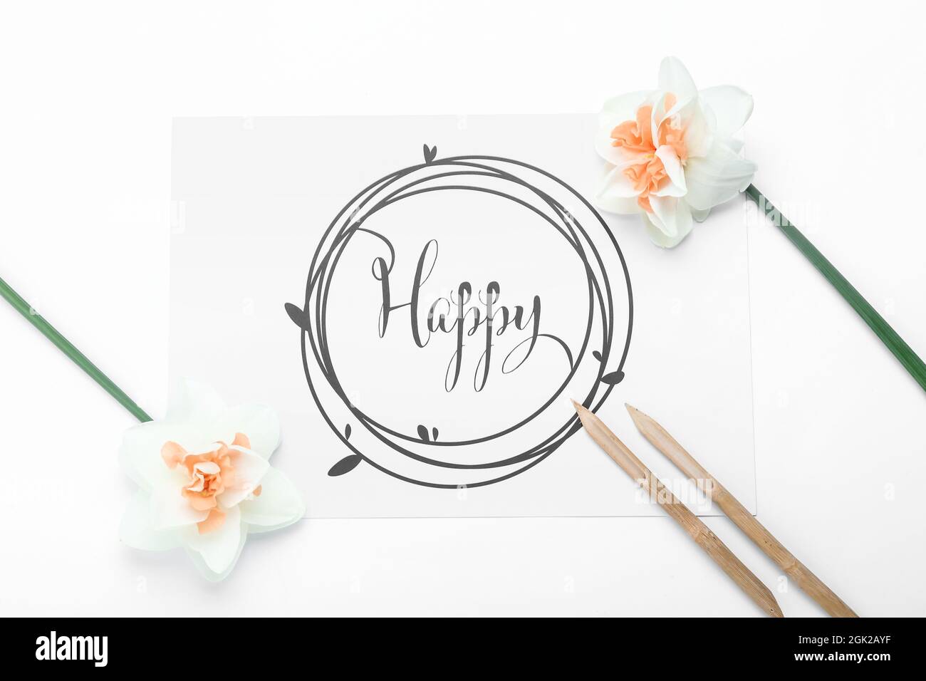 Paper with word HAPPY, dip pens and flowers on white background Stock ...