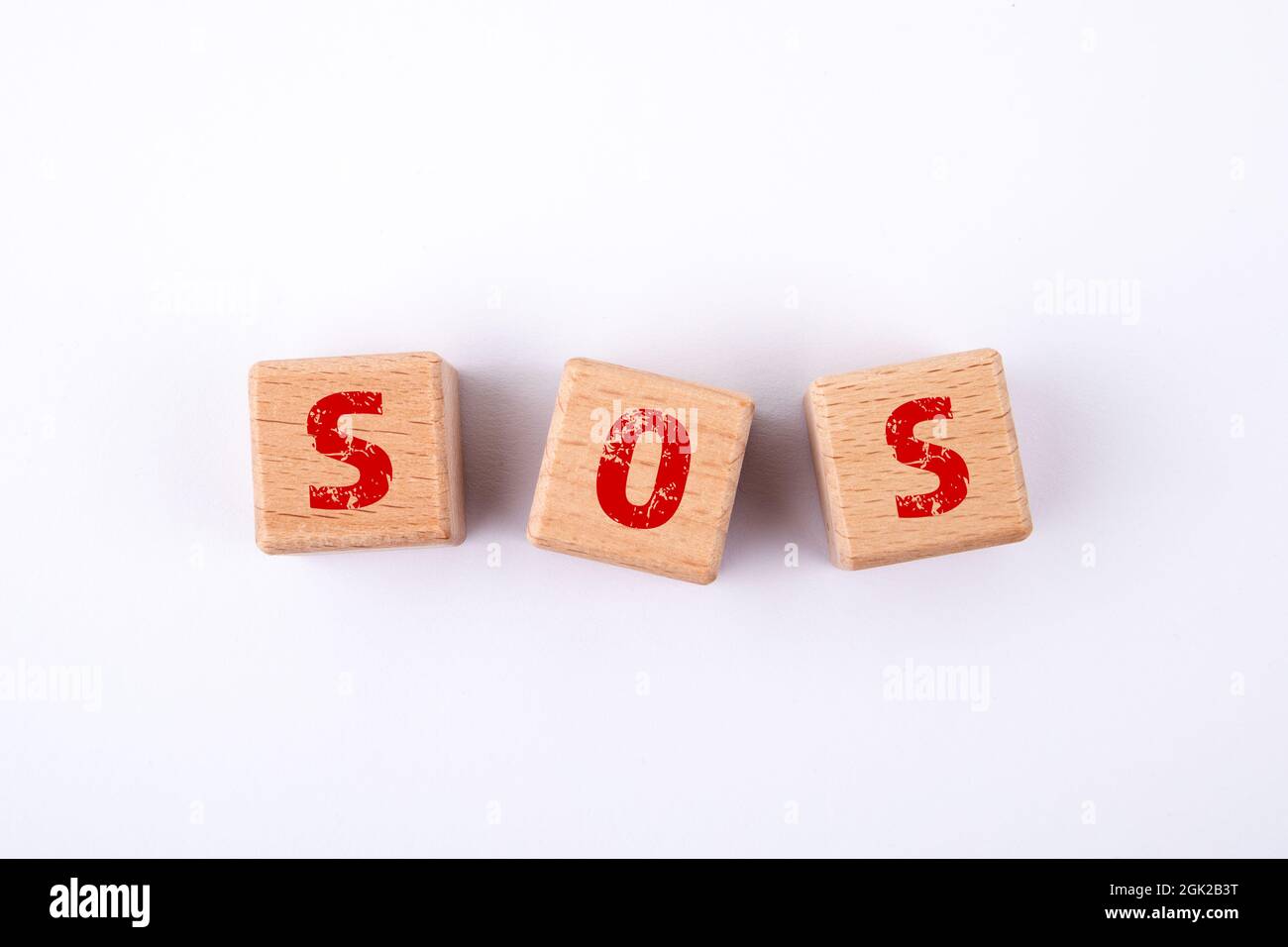 SOS. Wooden blocks with an inscription on a white background Stock ...