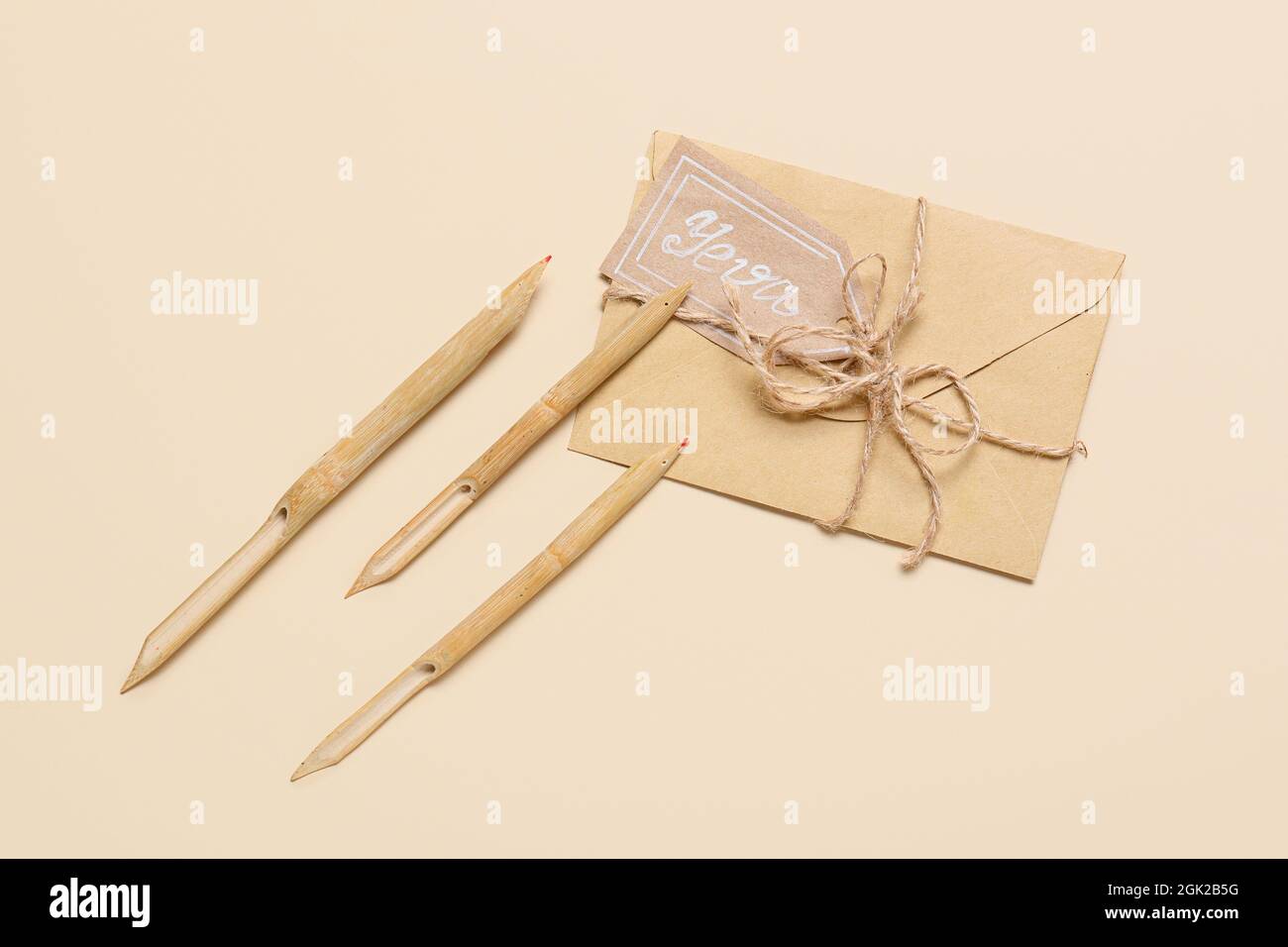 Envelope with name YEVA and dip pens on beige background Stock Photo ...