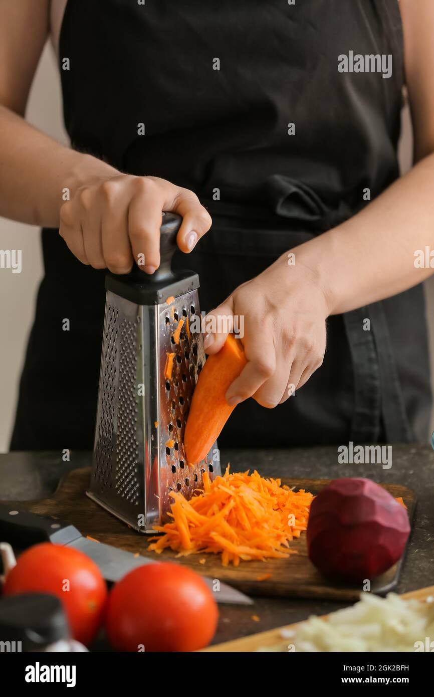 Woman grating carrot delicious hi-res stock photography and images - Alamy