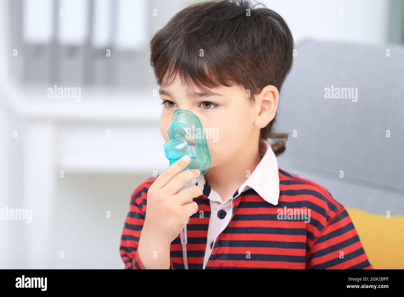 Boy using asthma machine at home Stock Photo - Alamy