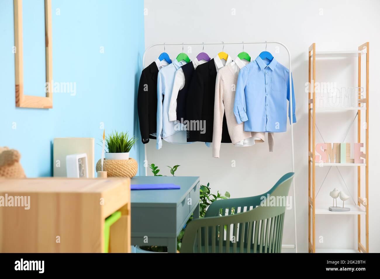 Interior of stylish room with school uniform Stock Photo - Alamy