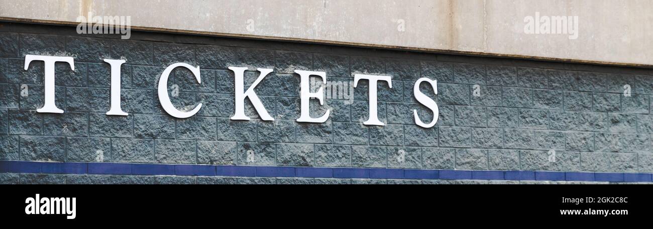 Tickets sign on wall of building Stock Photo - Alamy