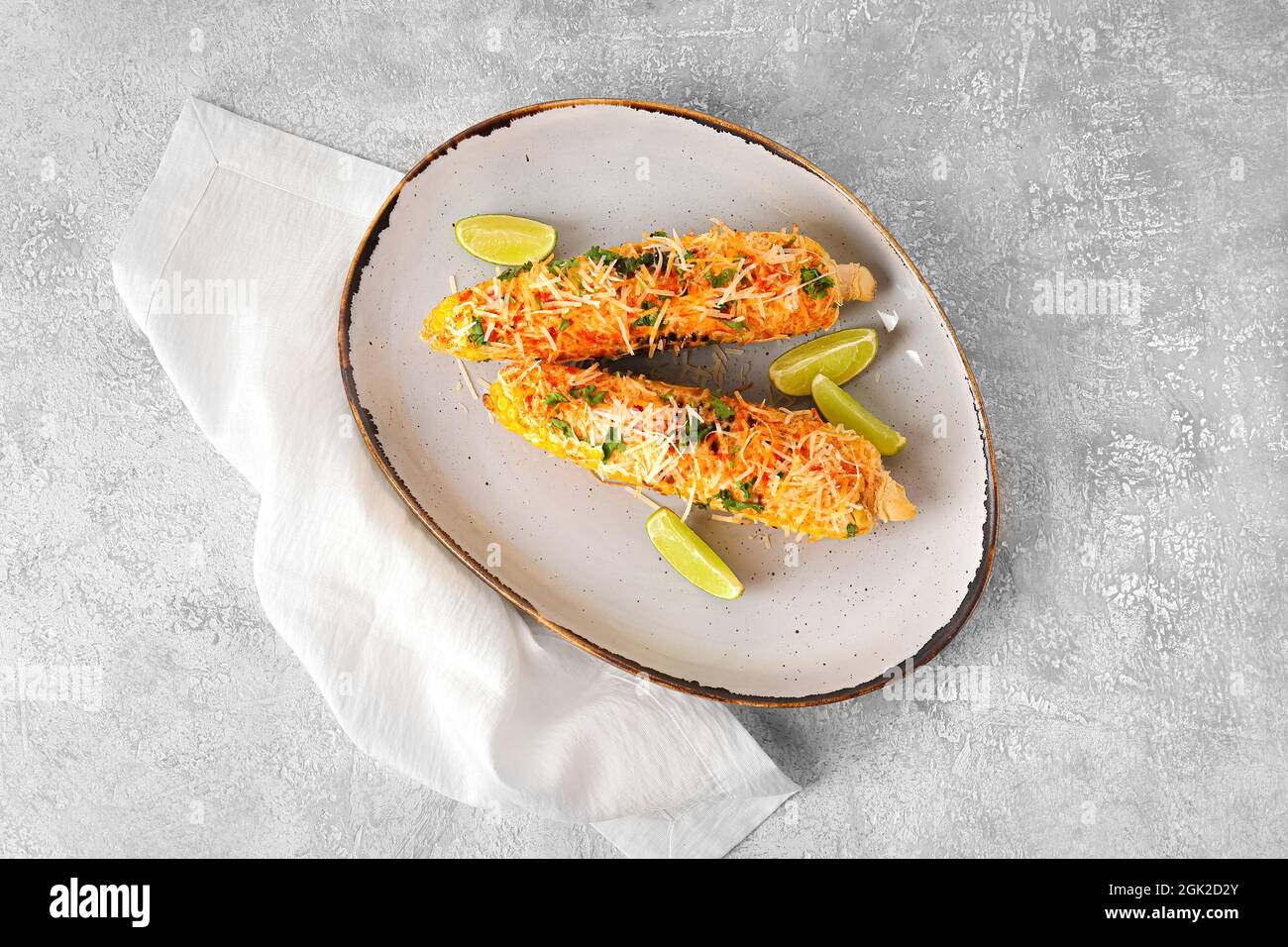 Plate with tasty Elote Mexican Street Corn on white background Stock ...
