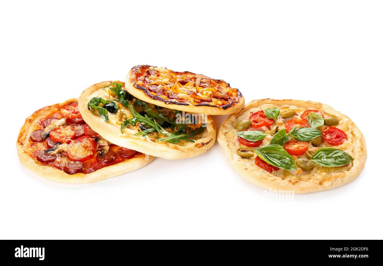 Tasty mini pizzas on white background Stock Photo - Alamy