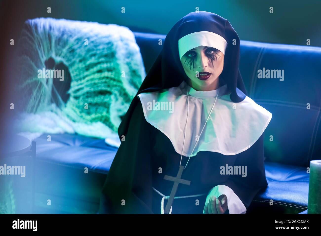 Woman dressed as nun at Halloween party Stock Photo - Alamy