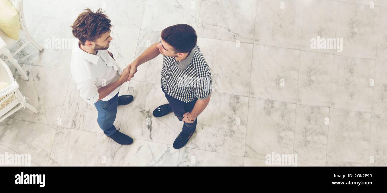 Business Partners Team meeting holding hand together as a Team Building ...