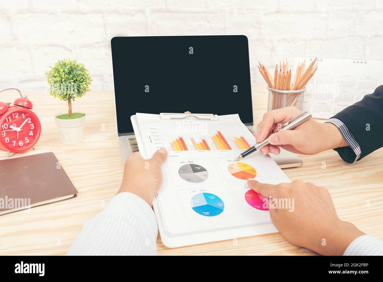 Collaboration worker in office working together with Excel graph with ...