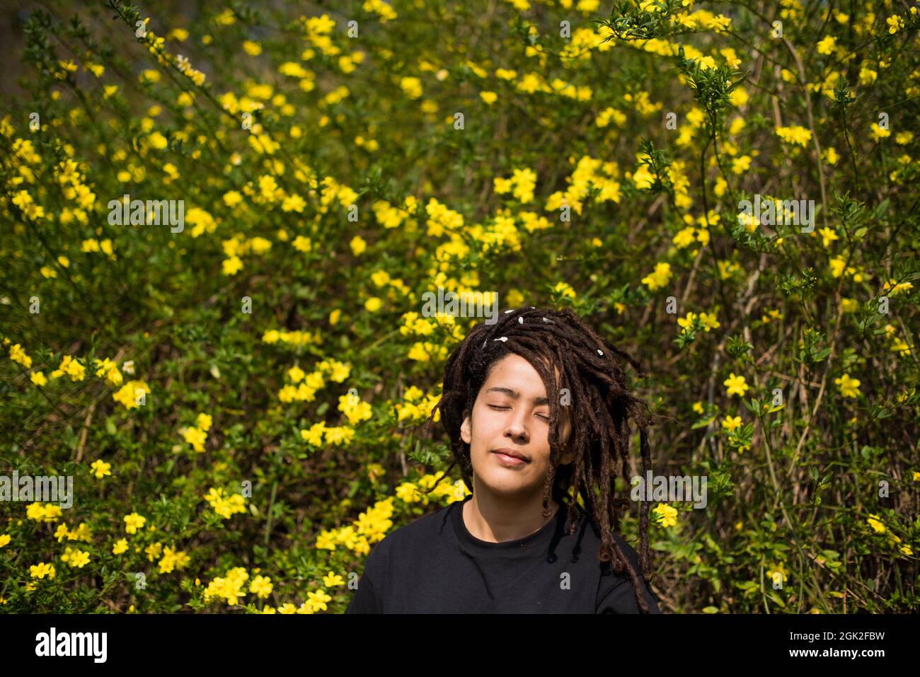 Beautiful woman with locs shot in nature Stock Photo - Alamy