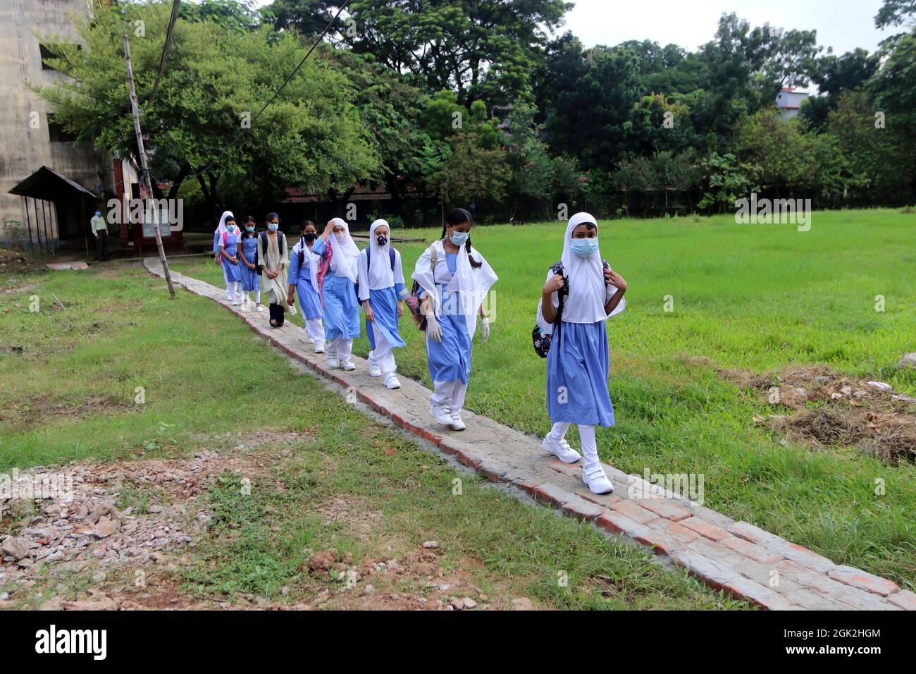 Non Exclusive: A student snap your fist with their classmate during the ...