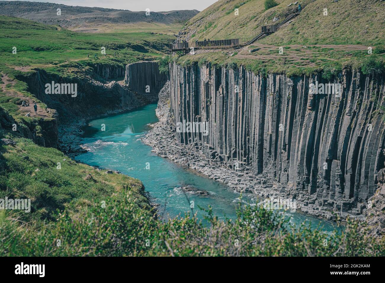 Overview of Studlagil canyon in Iceland, picturesque valley with basalt columns standing high on ...