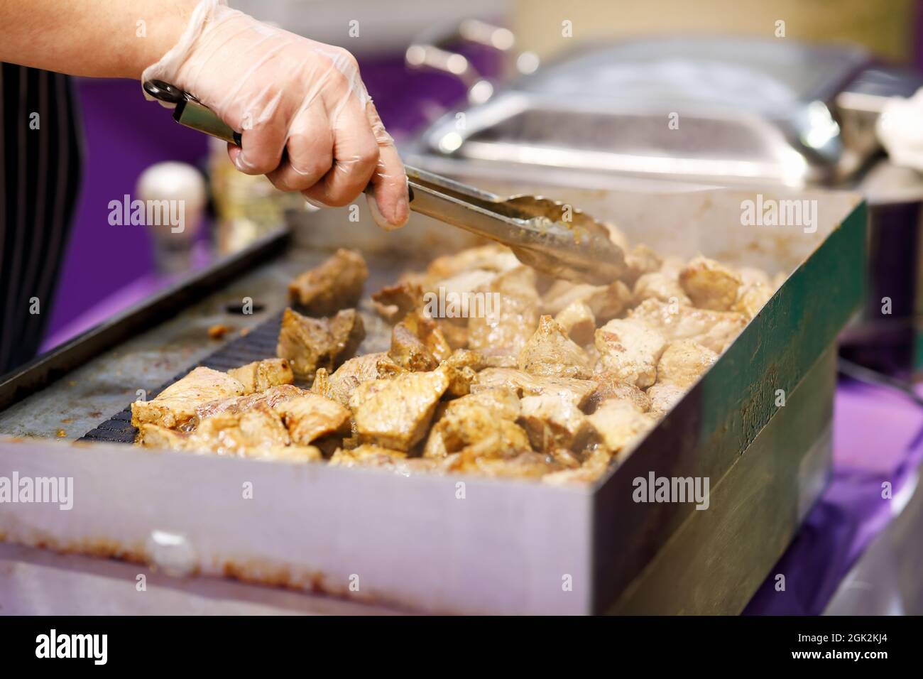 Frying meat in a fast food restaurant. Selective focus Stock Photo - Alamy