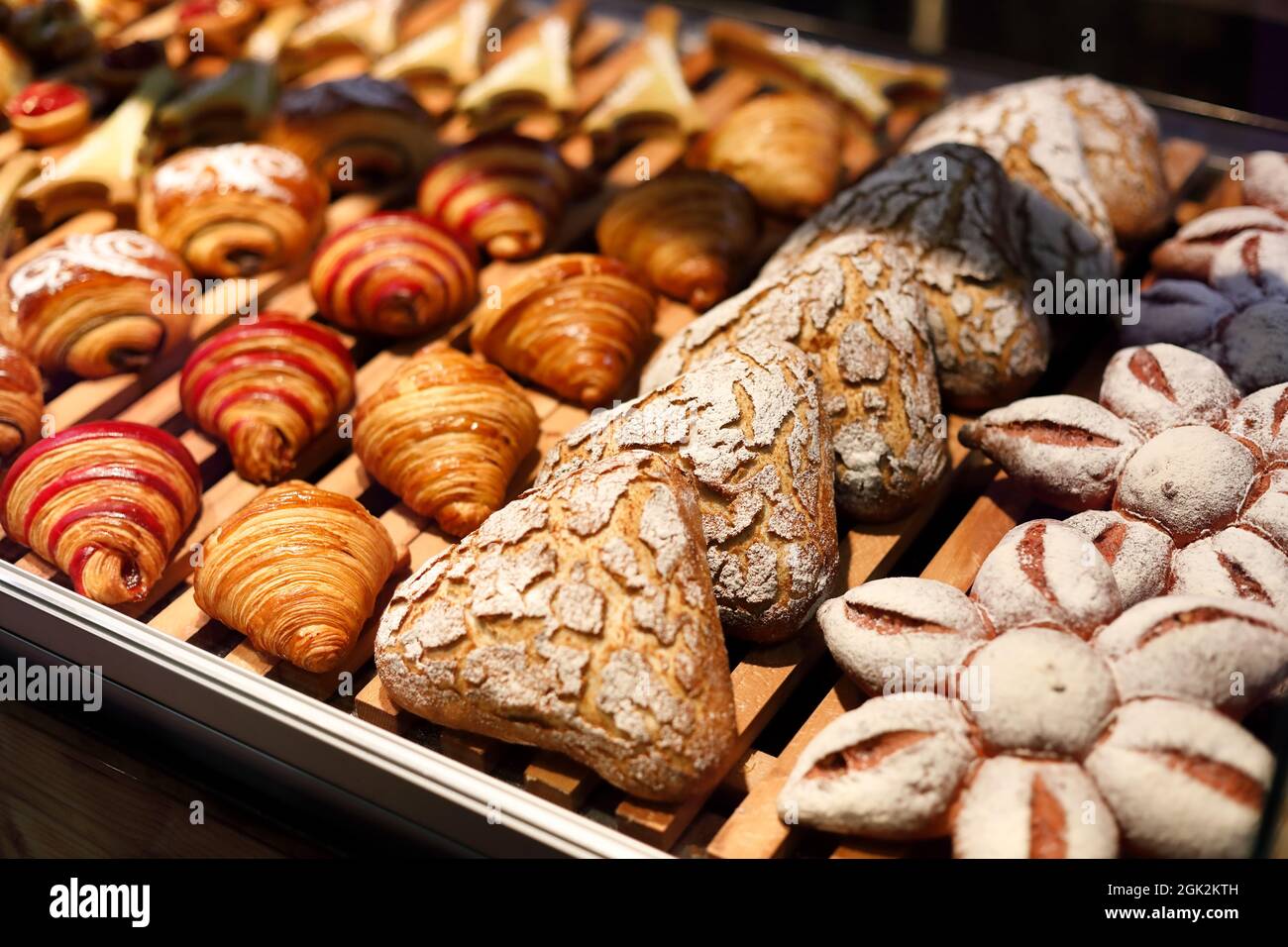 Sweet pastries on the shelf in a supermarket. Selective focus Stock ...