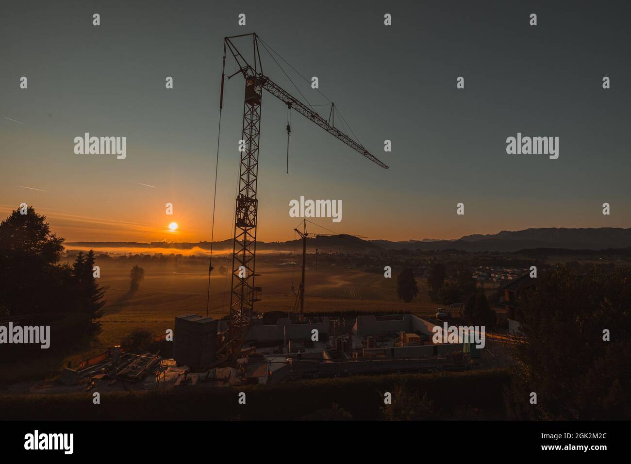 Construction site of an apartment building in early morning with ...