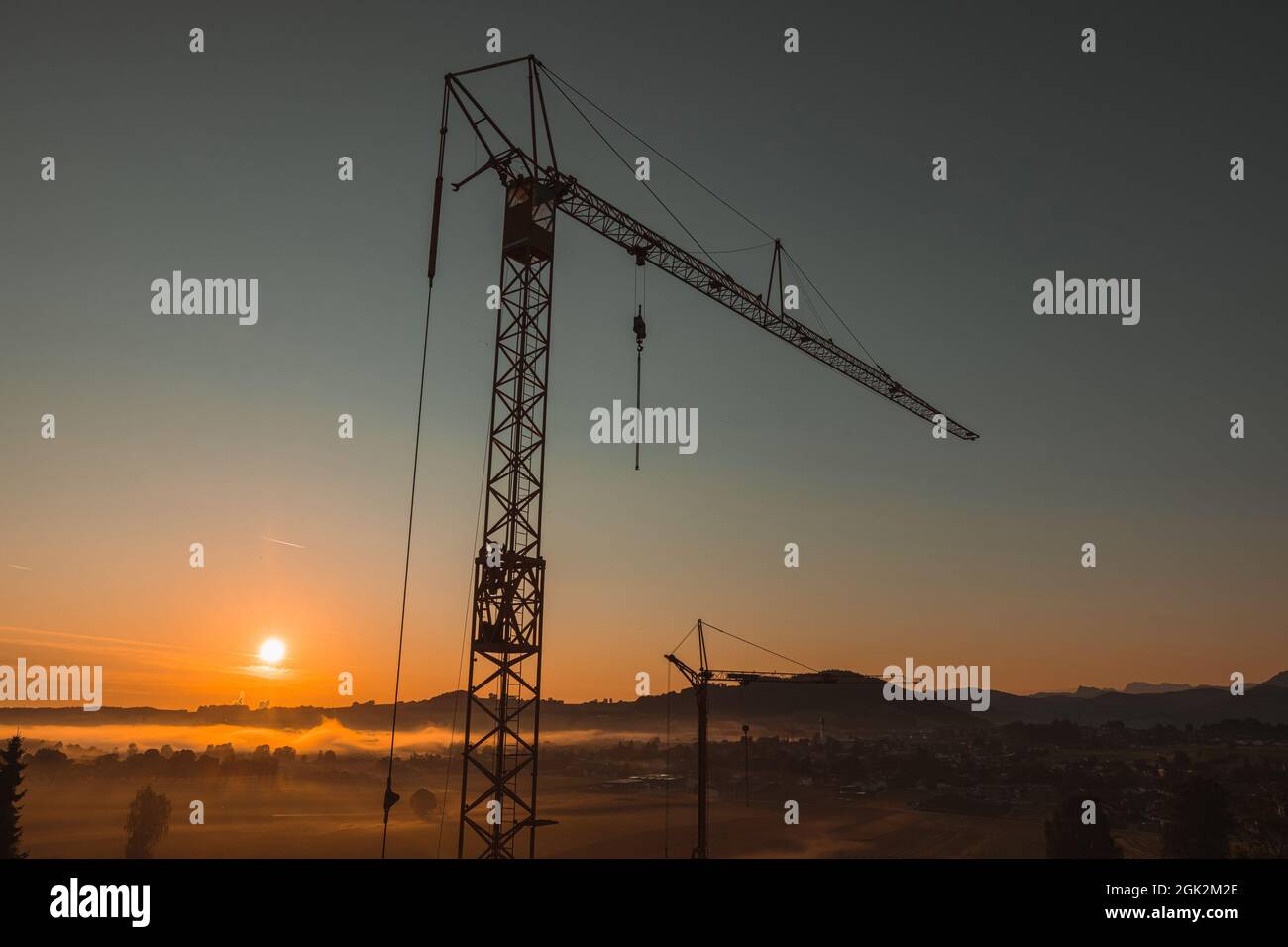 Construction site of an apartment building in early morning with ...