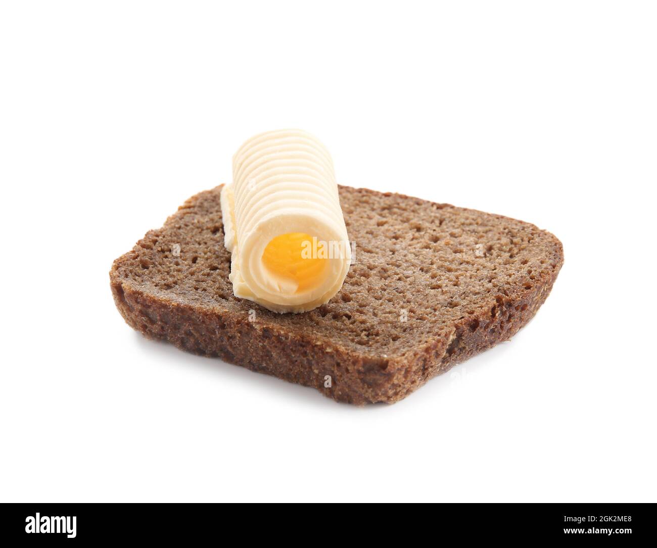 Slice of bread with butter curl on white background Stock Photo - Alamy