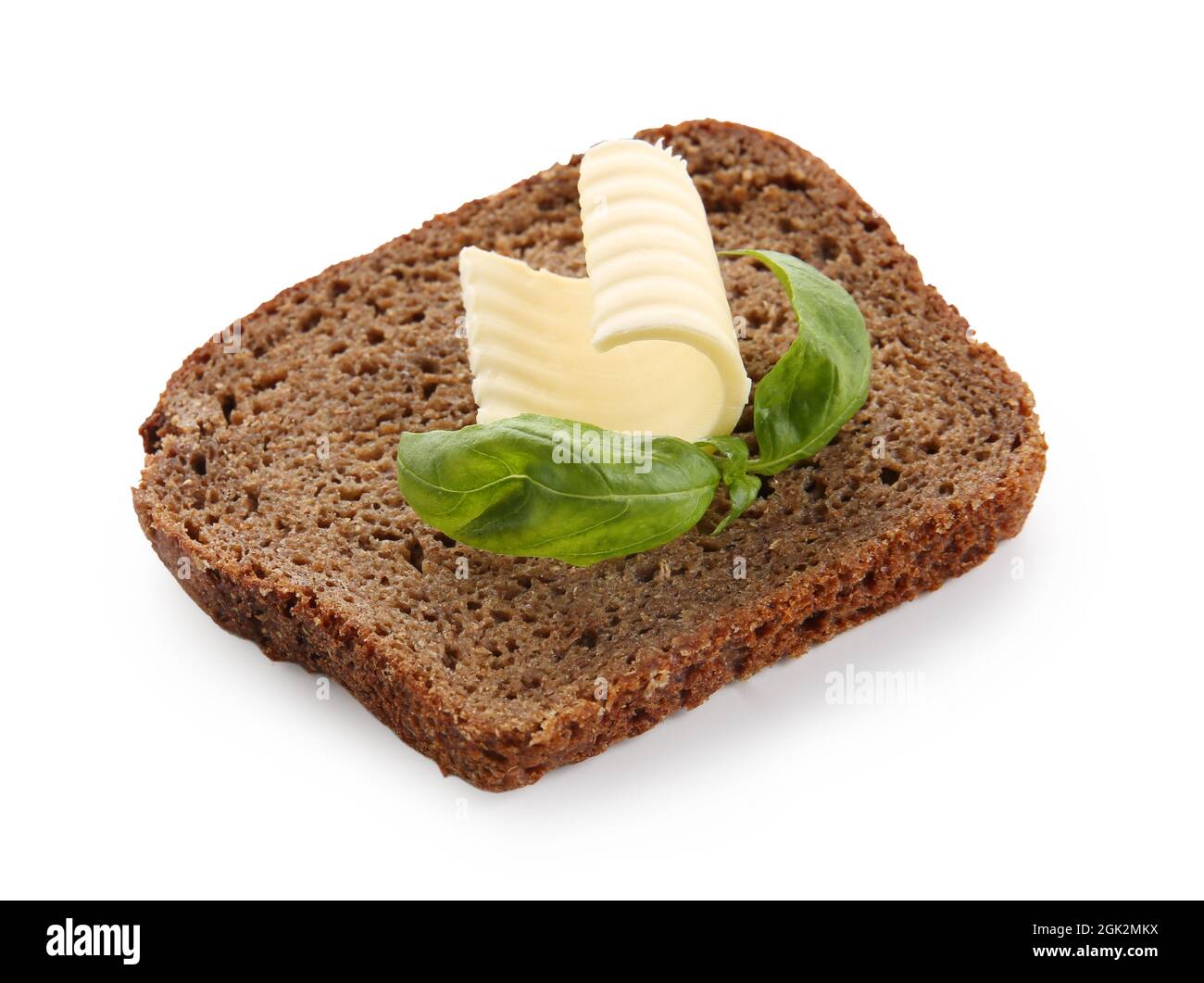 Slice of bread with butter curl on white background Stock Photo - Alamy