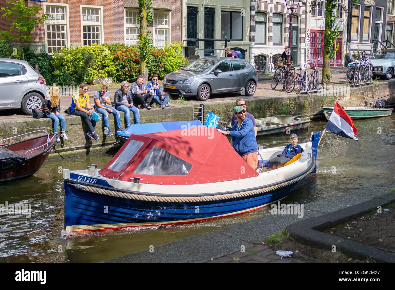 Amsterdam-Netherlands - August 21 2017; Quaint small blue boat with red ...
