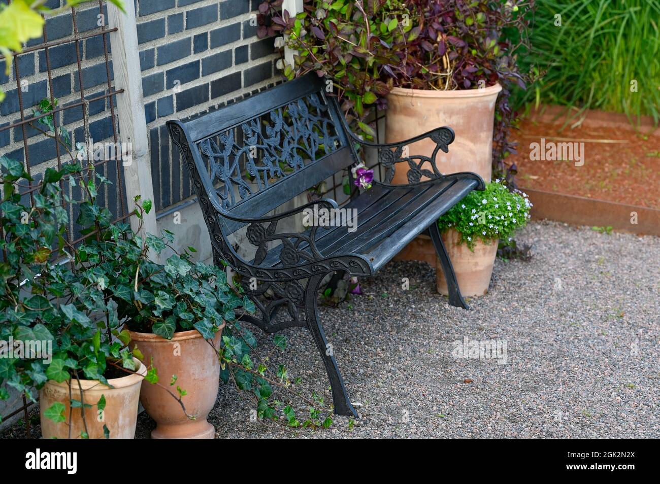 calm resting area in public park with bench Stock Photo - Alamy