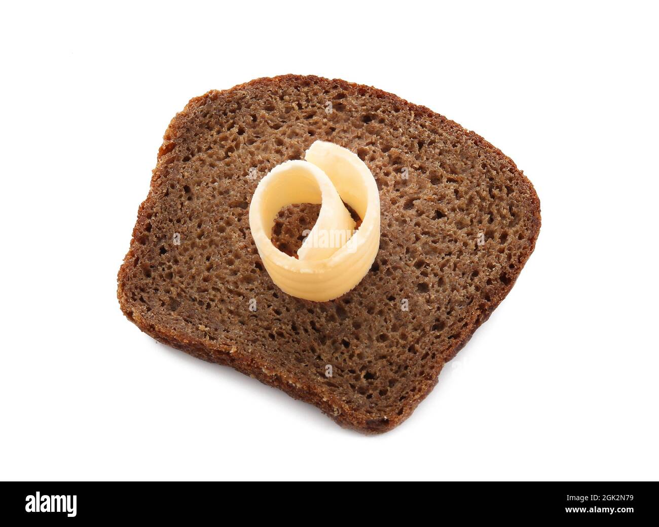 Slice of bread with butter curl on white background Stock Photo - Alamy