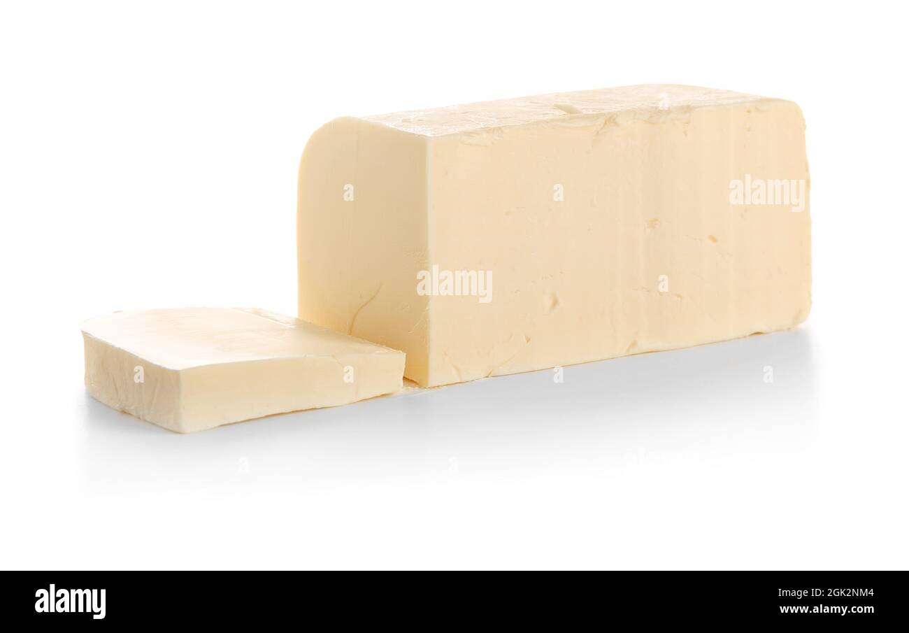 Cut piece of butter on white background Stock Photo - Alamy