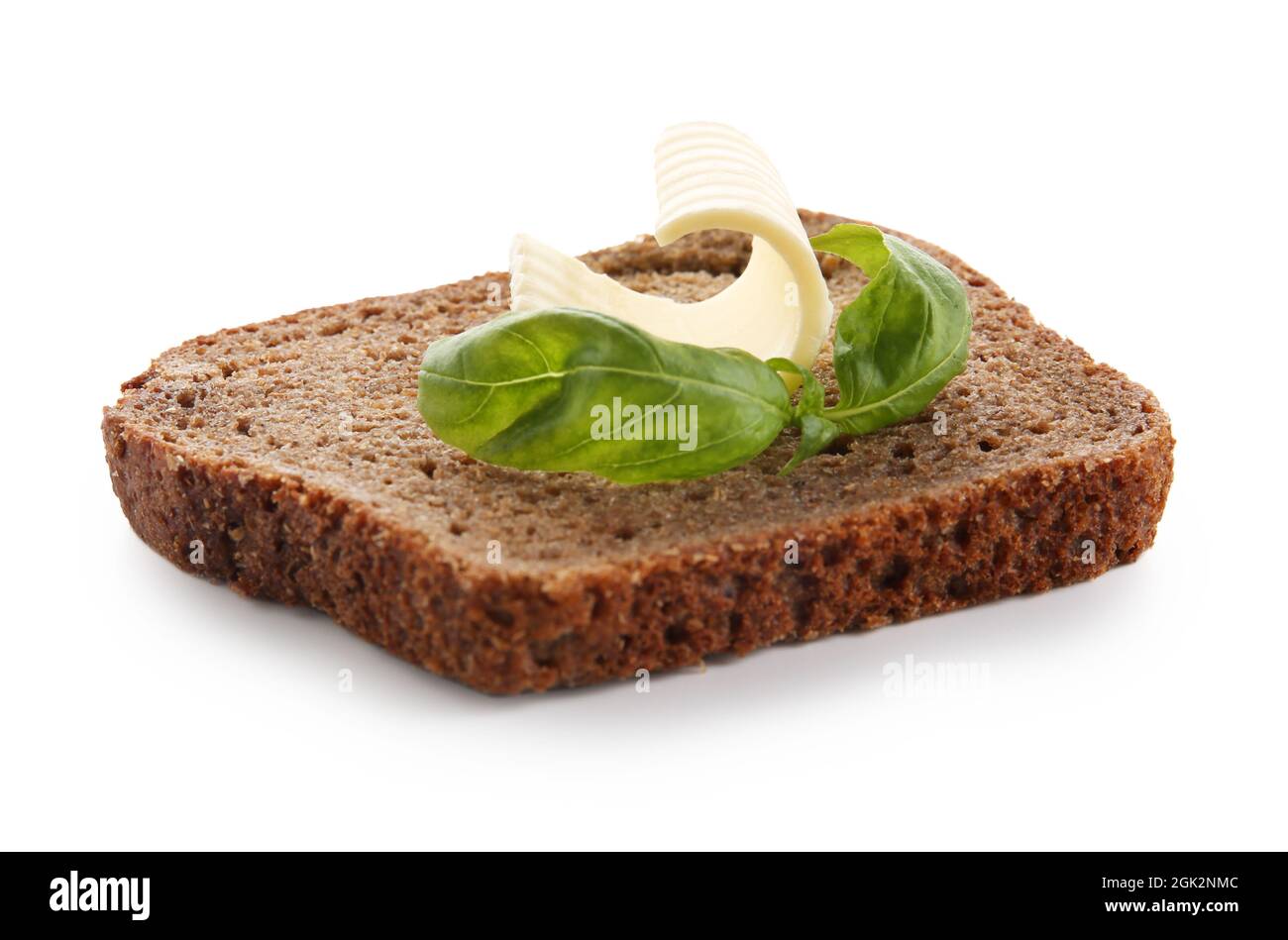 Slice of bread with butter curl on white background Stock Photo - Alamy