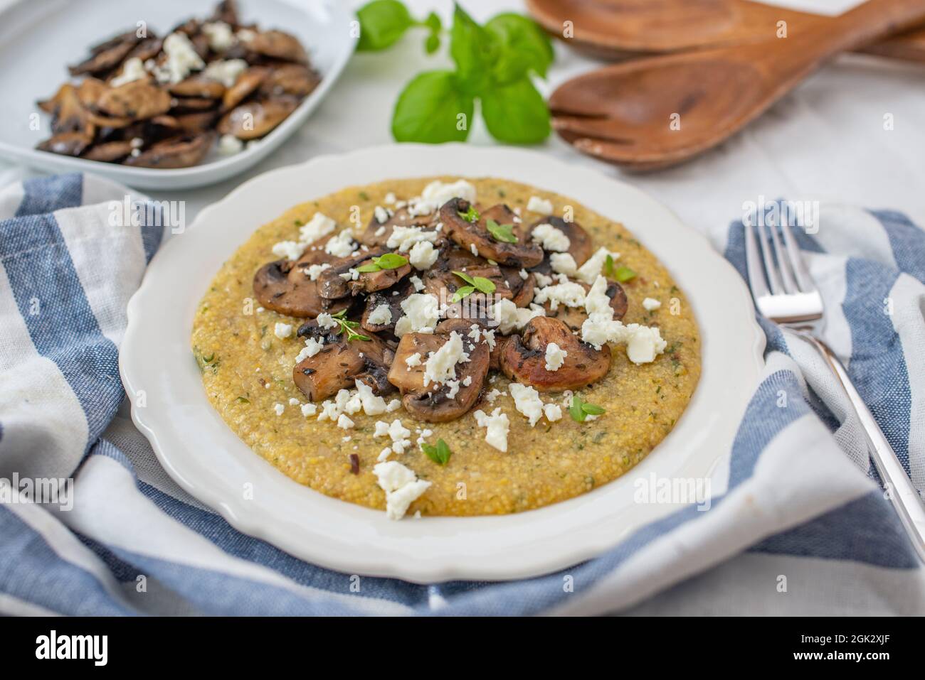 Traditional polenta with mushrooms and cheese on a plate Stock Photo ...