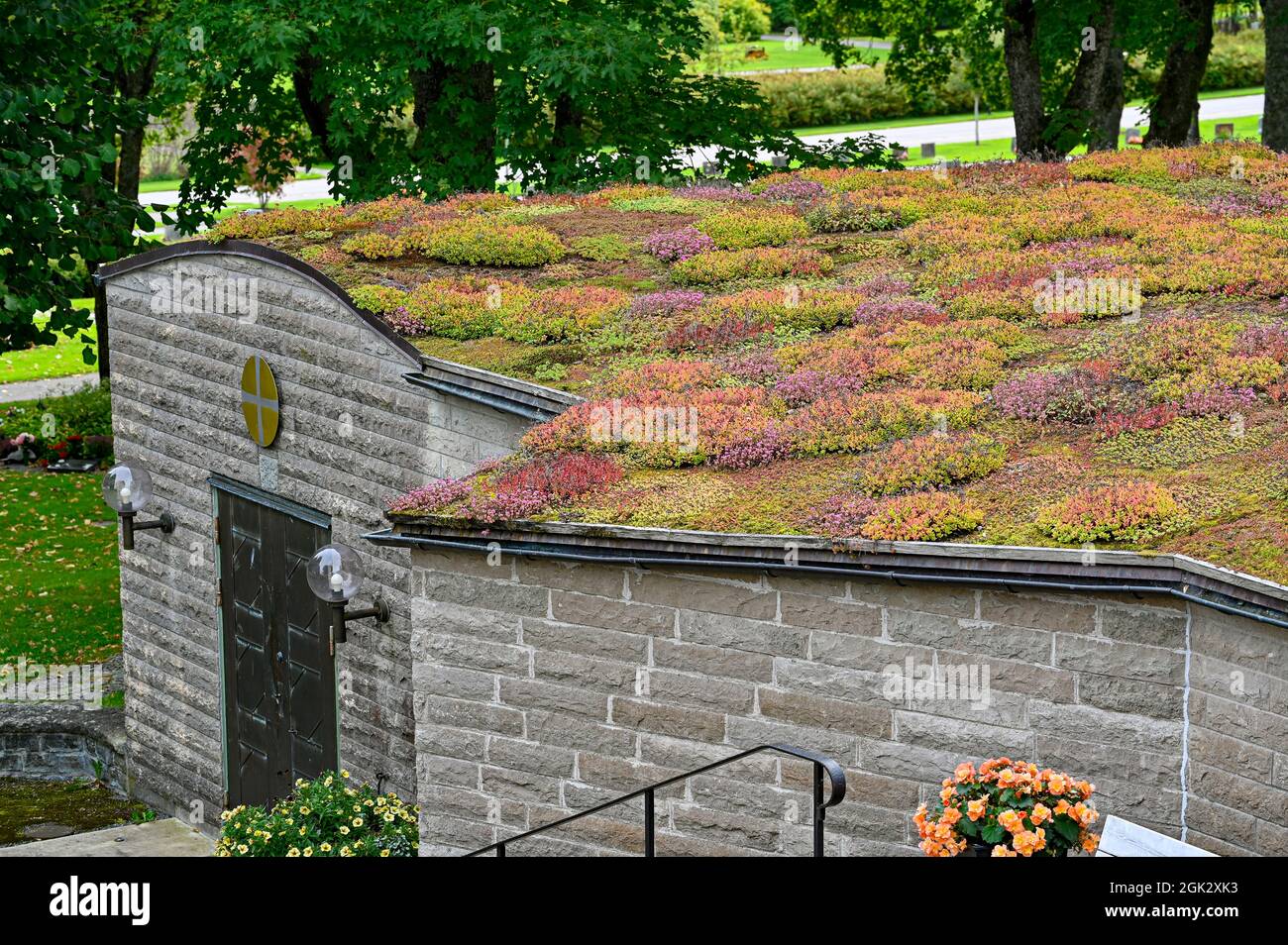 roof covered in colorful succulents on building in cementery Stock ...