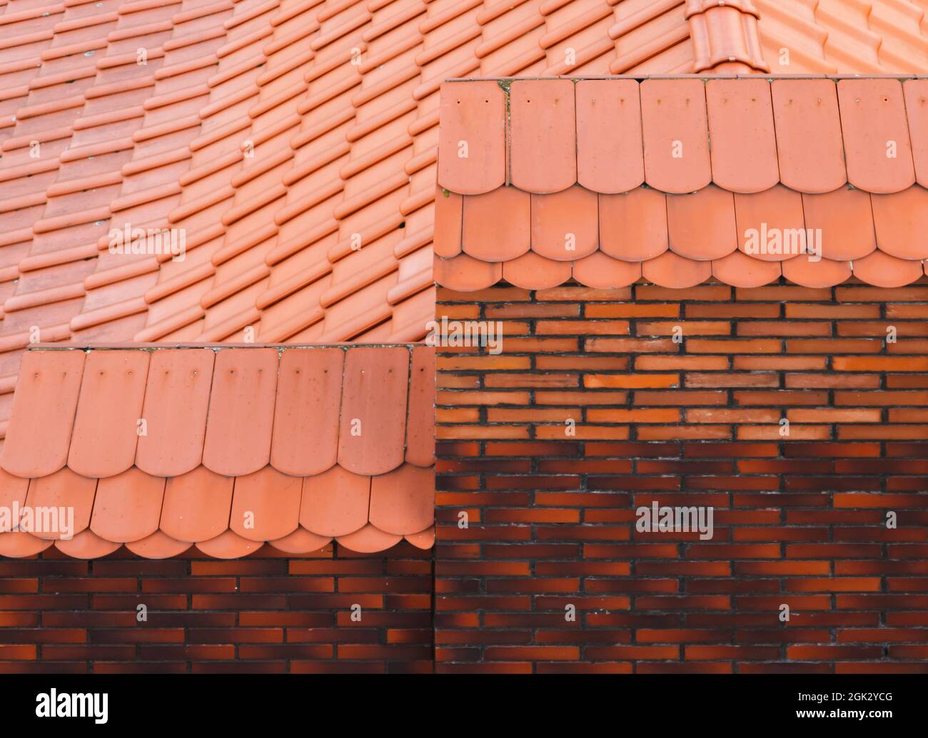 Red roof tiling and brick walls, architectural background photo Stock ...