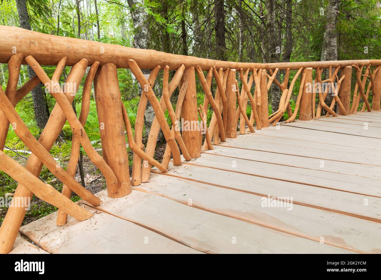 Railings of a wooden footbridge in a summer park, background photo ...