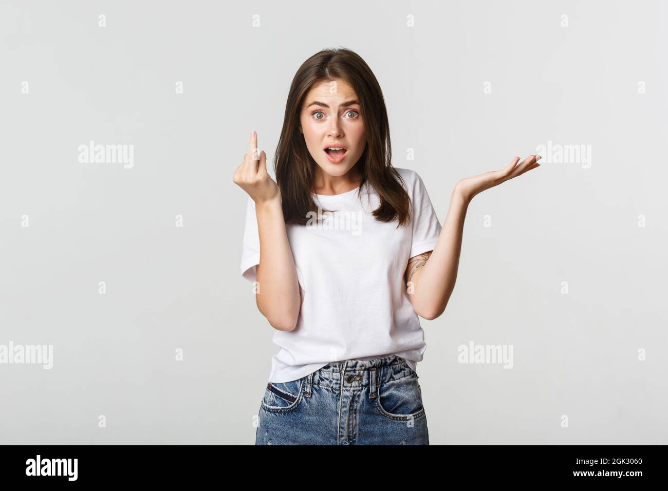 Confused and pissed-off brunette girl arguing about wedding, showing ...