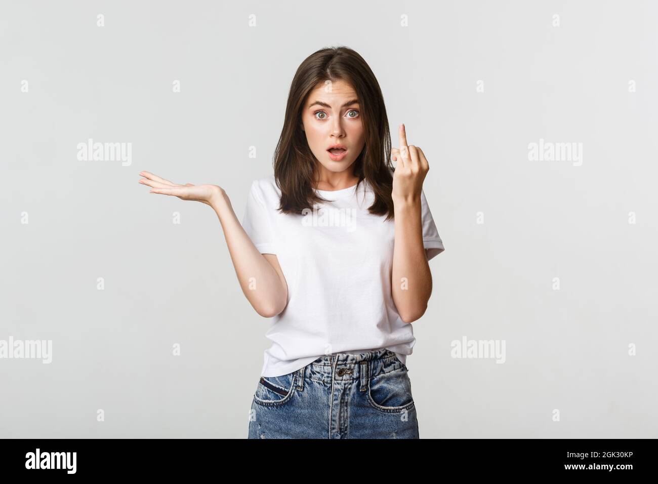 Confused and pissed-off brunette girl arguing about wedding, showing ...