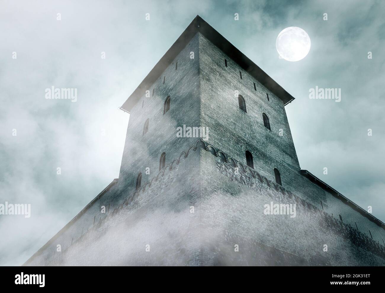Tower and wall of the medieval castle, fortress during foggy night with ...