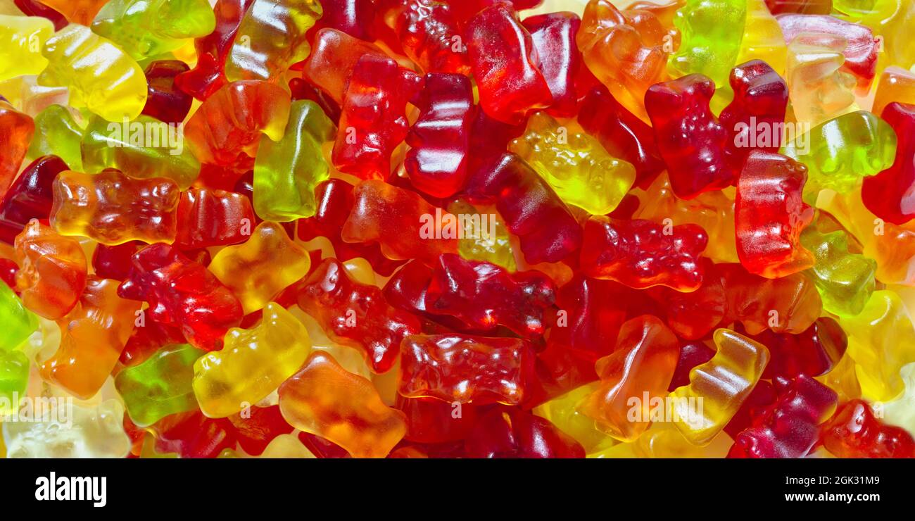 Background from gummy bears. Multi-colored chewy candies, vitamins ...