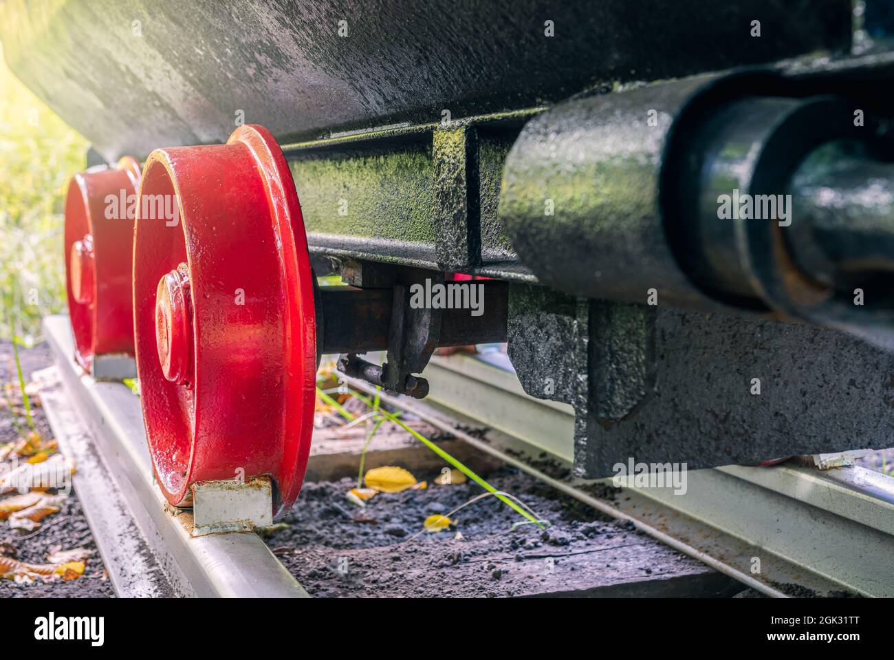 the undercarriage of a traditional mine cart. a restored, old mine car ...
