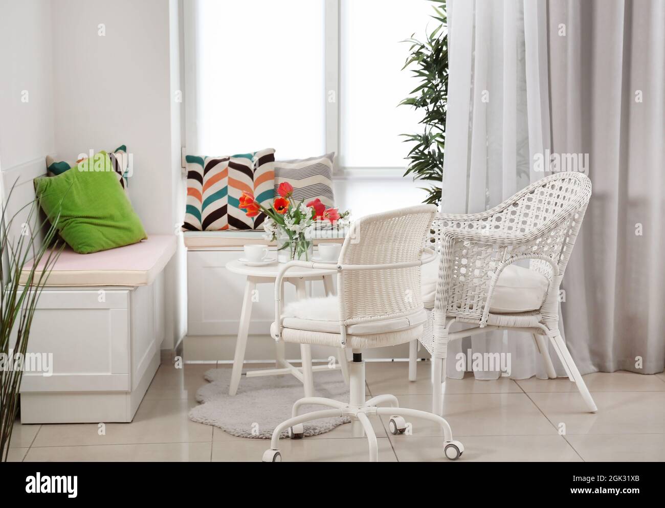 Beautiful modern veranda with cozy armchairs and coffee table Stock ...