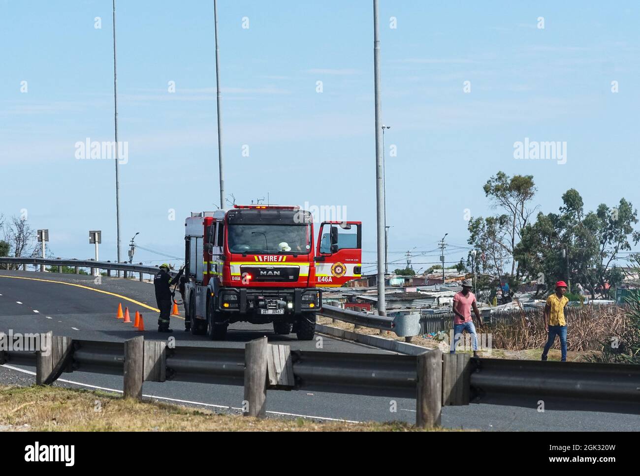 Cape Town fire engine at work in an African township with people Stock ...