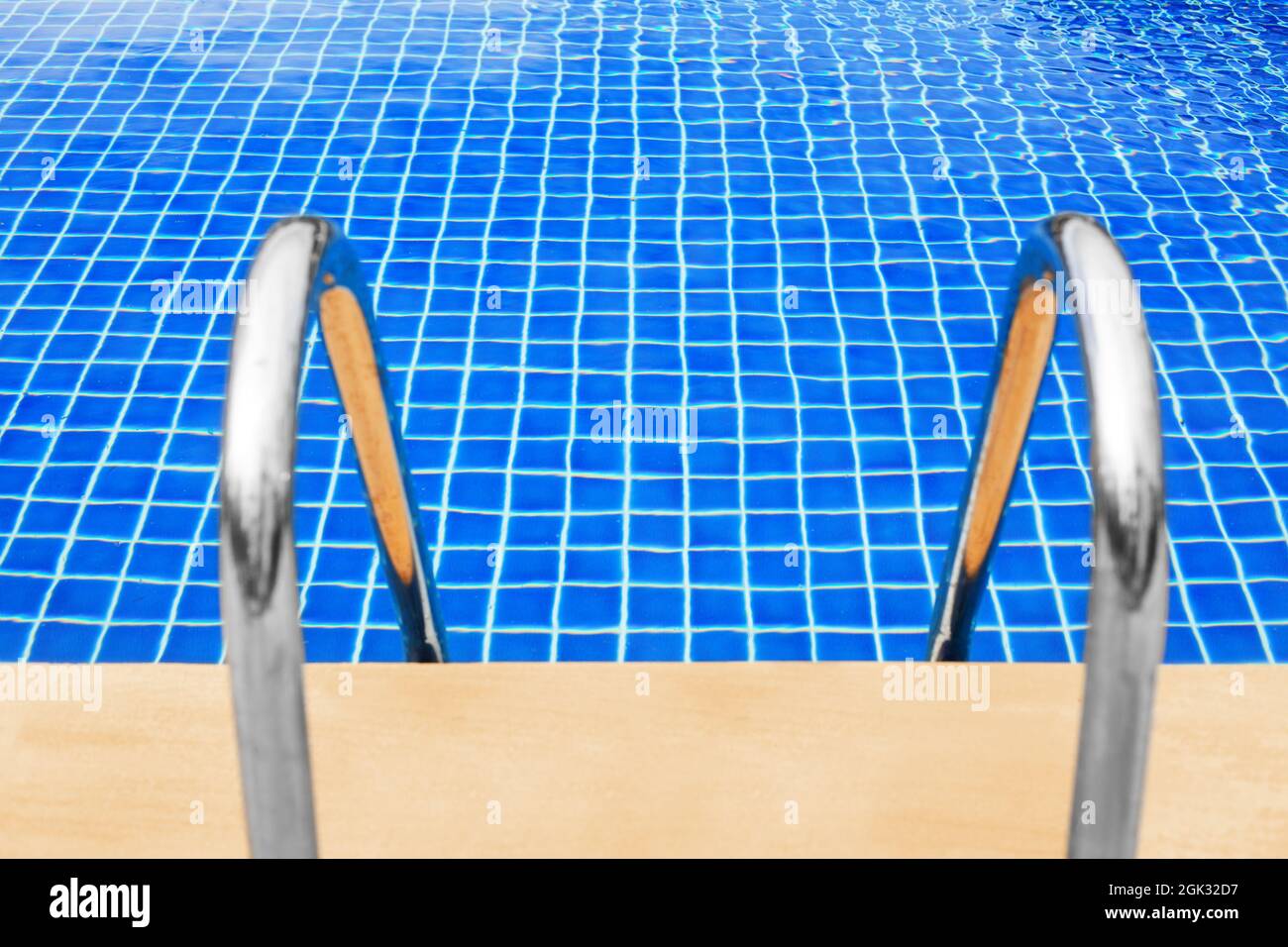 Swimming pool entrance stair closeup, metal grab bar ladder, swimming ...