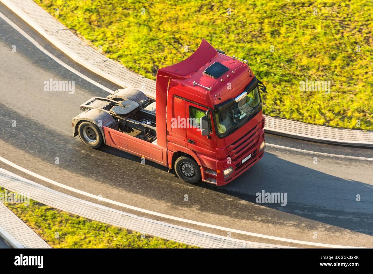 Modern truck without at the turn of the highway Stock Photo - Alamy