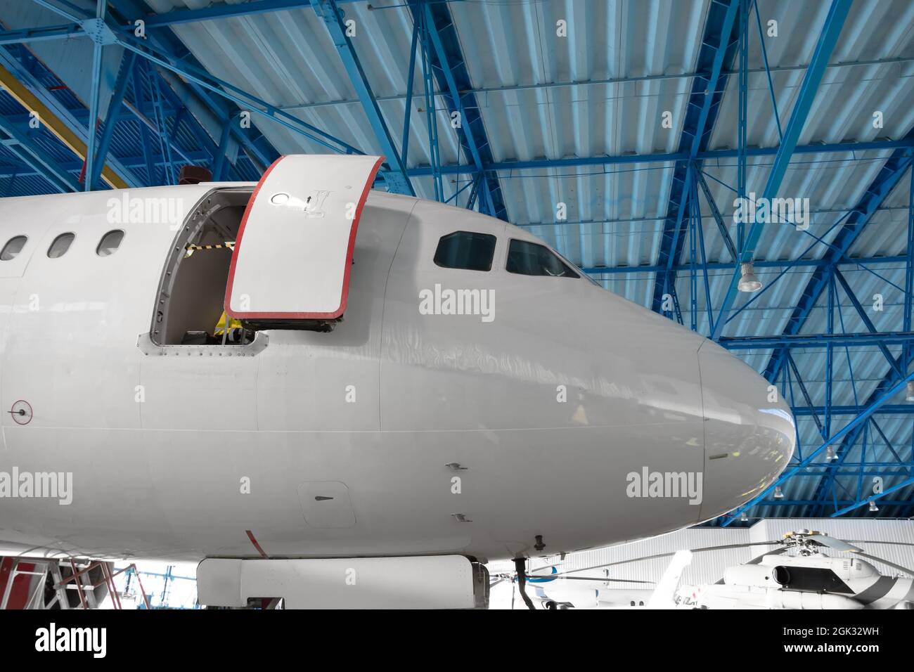 The nose of the aircraft cockpit in the maintenance hangar Stock Photo ...