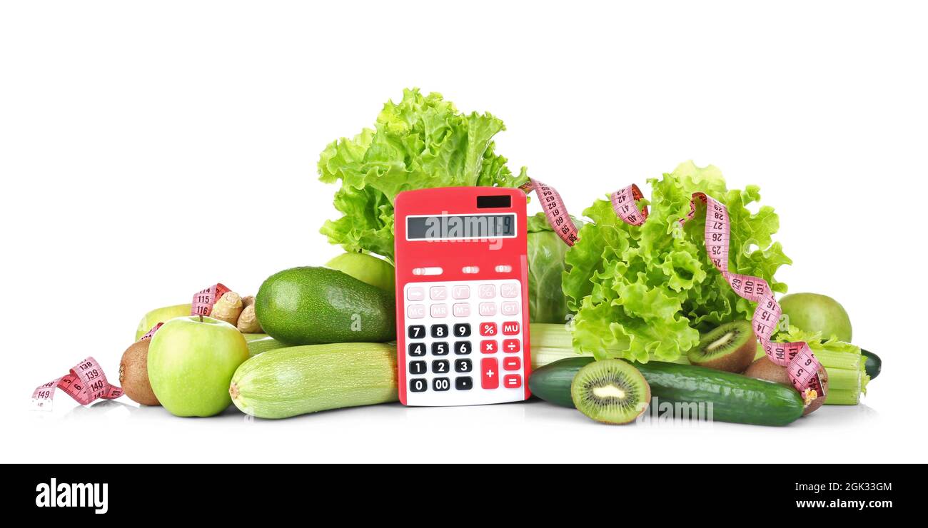 Weight loss concept. Fresh vegetables, fruits, calculator and measuring ...
