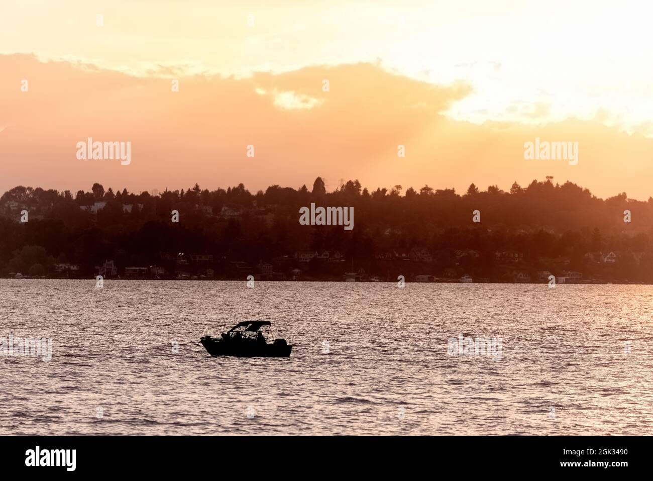 single boat floating out in the puget sound Stock Photo - Alamy