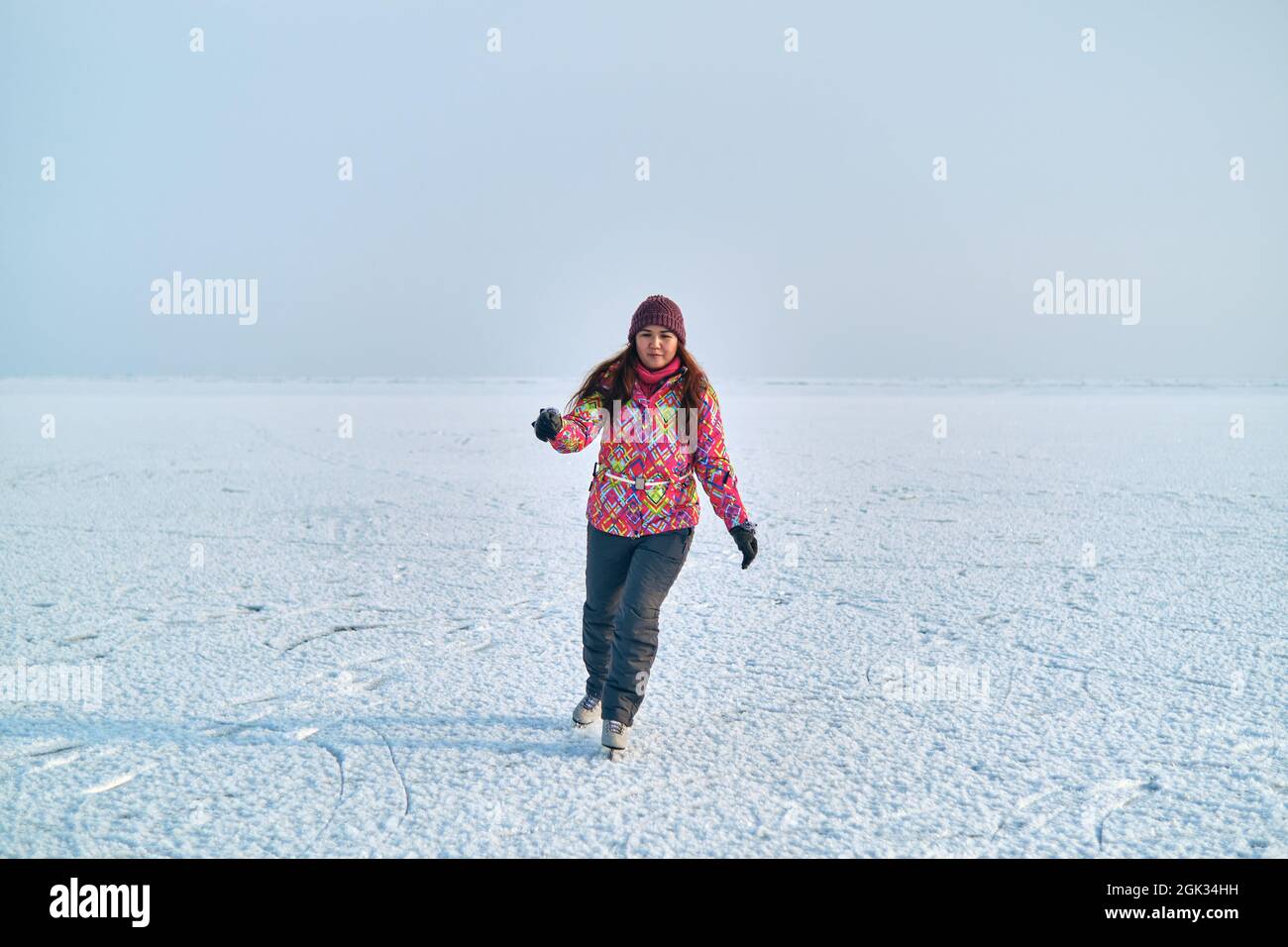 Winter outdoor activities, woman ice skating on a frozen lake Stock ...