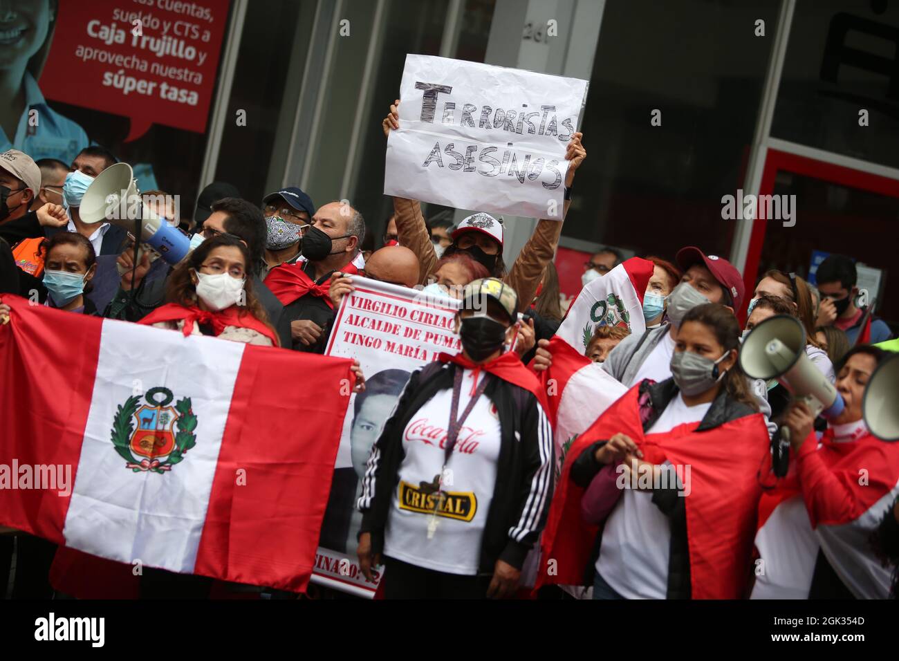 Lima, Peru. 12th Sep, 2021. Men and women cheer the death of Peruvian ...