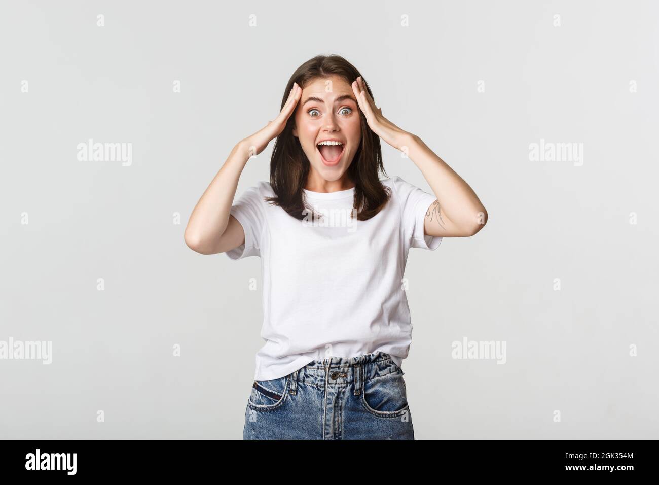 Portrait of surprised attractive girl looking excited and smiling ...