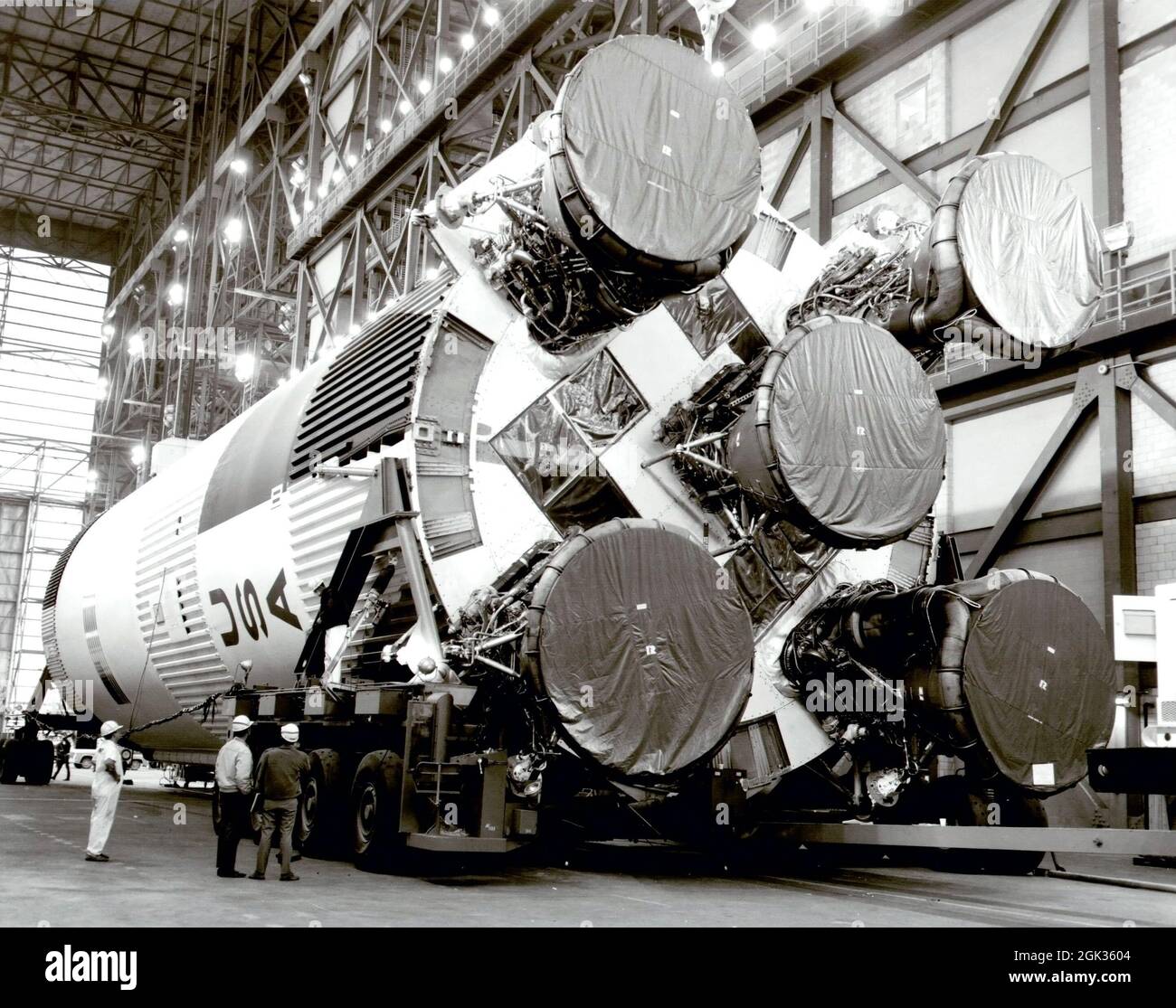 Teams attach the S-1C (first stage) booster for the Apollo 11 Saturn V ...